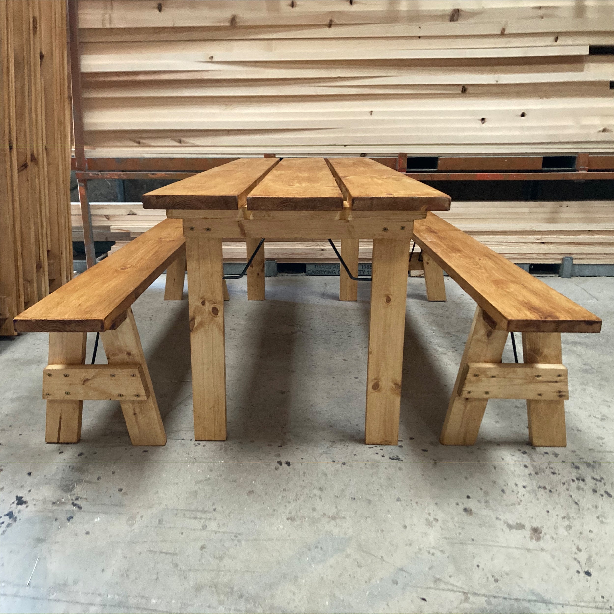 3. Indoor Folding Rustic-style Bench – The Trestle Table Company